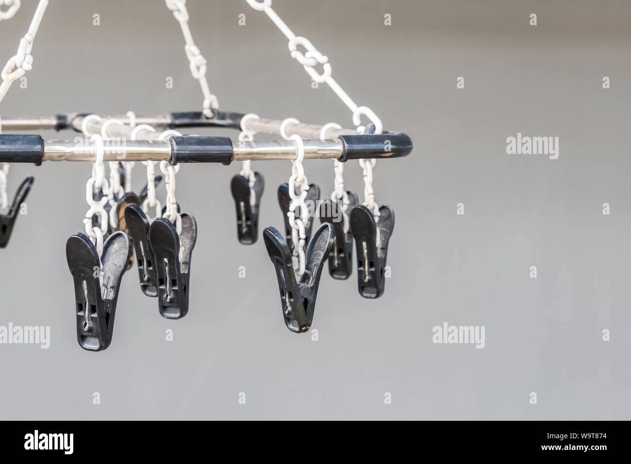 Plastic clothespin hanger on the closth line near the house wall Stock ...