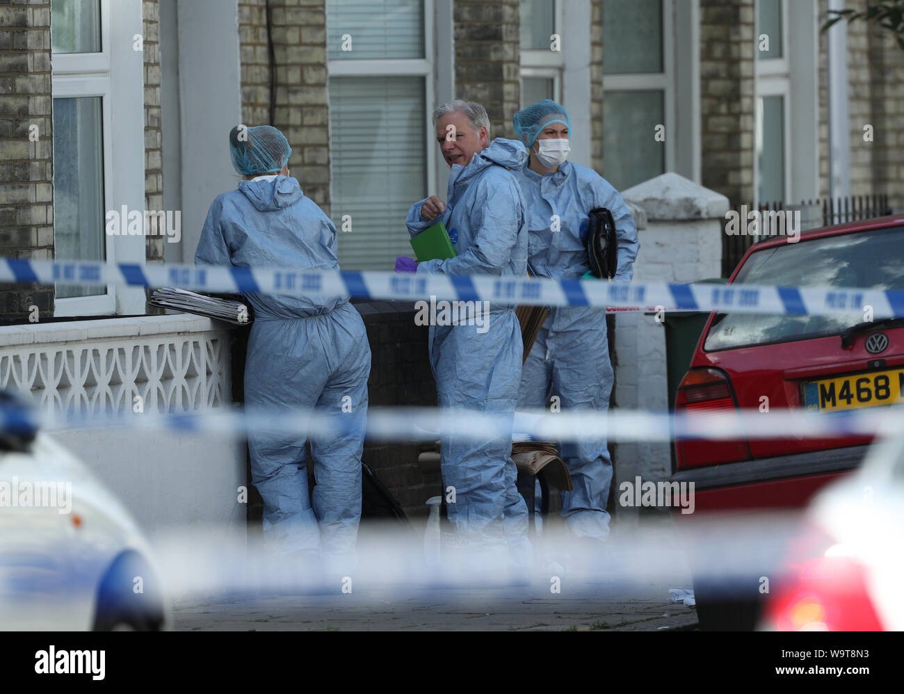 Forensic officers at the scene of a fatal stabbing in Corrance Road ...