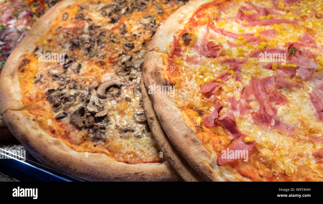 Pizza on a shop window, close-up Stock Photo - Alamy