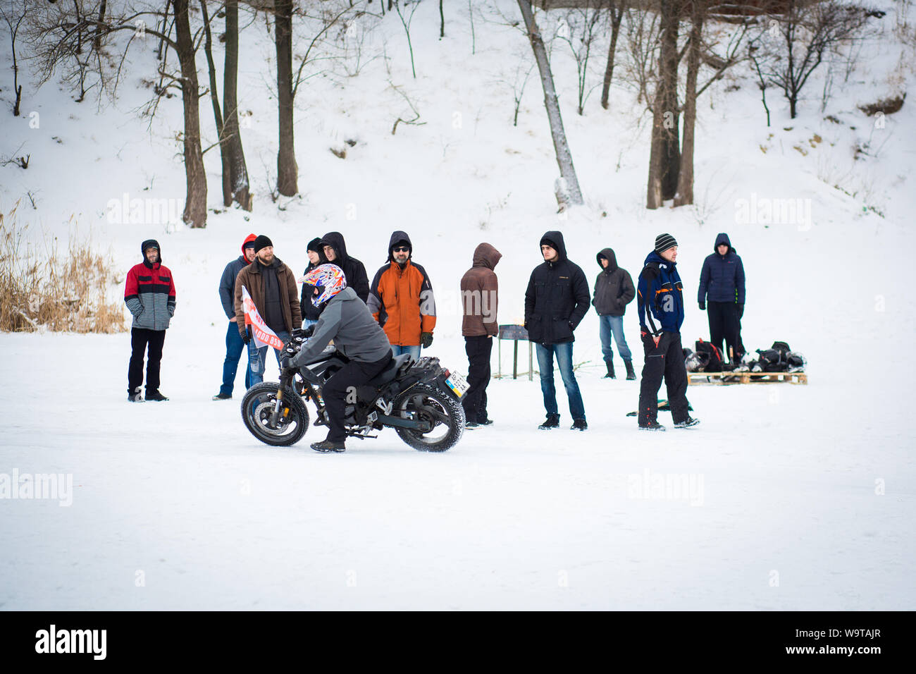 A guy rides a motorcycle on a frozen lake Stock Photo - Alamy