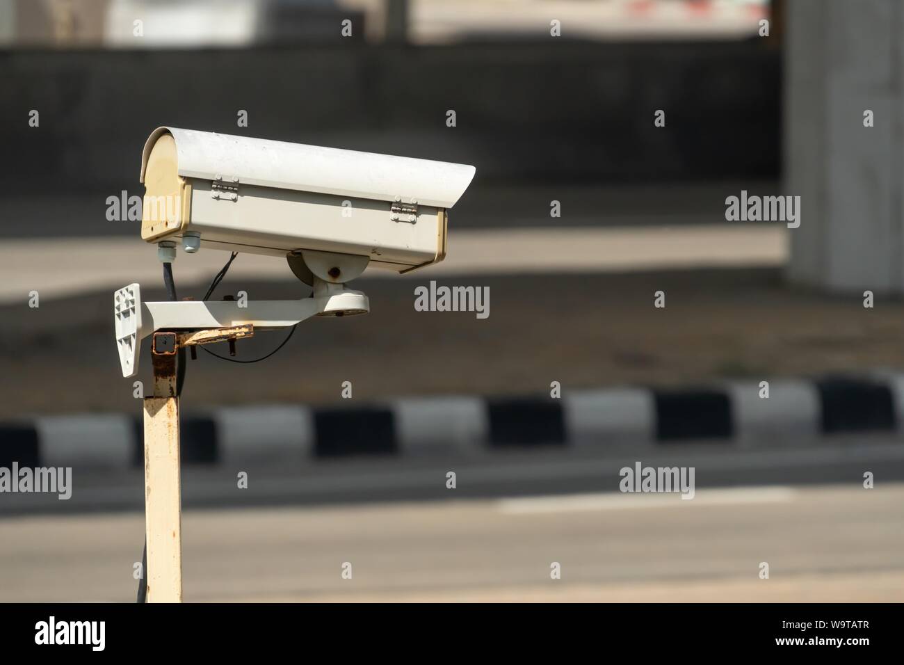 security monitoring CCTV camera mounted on old pole steel post Stock ...