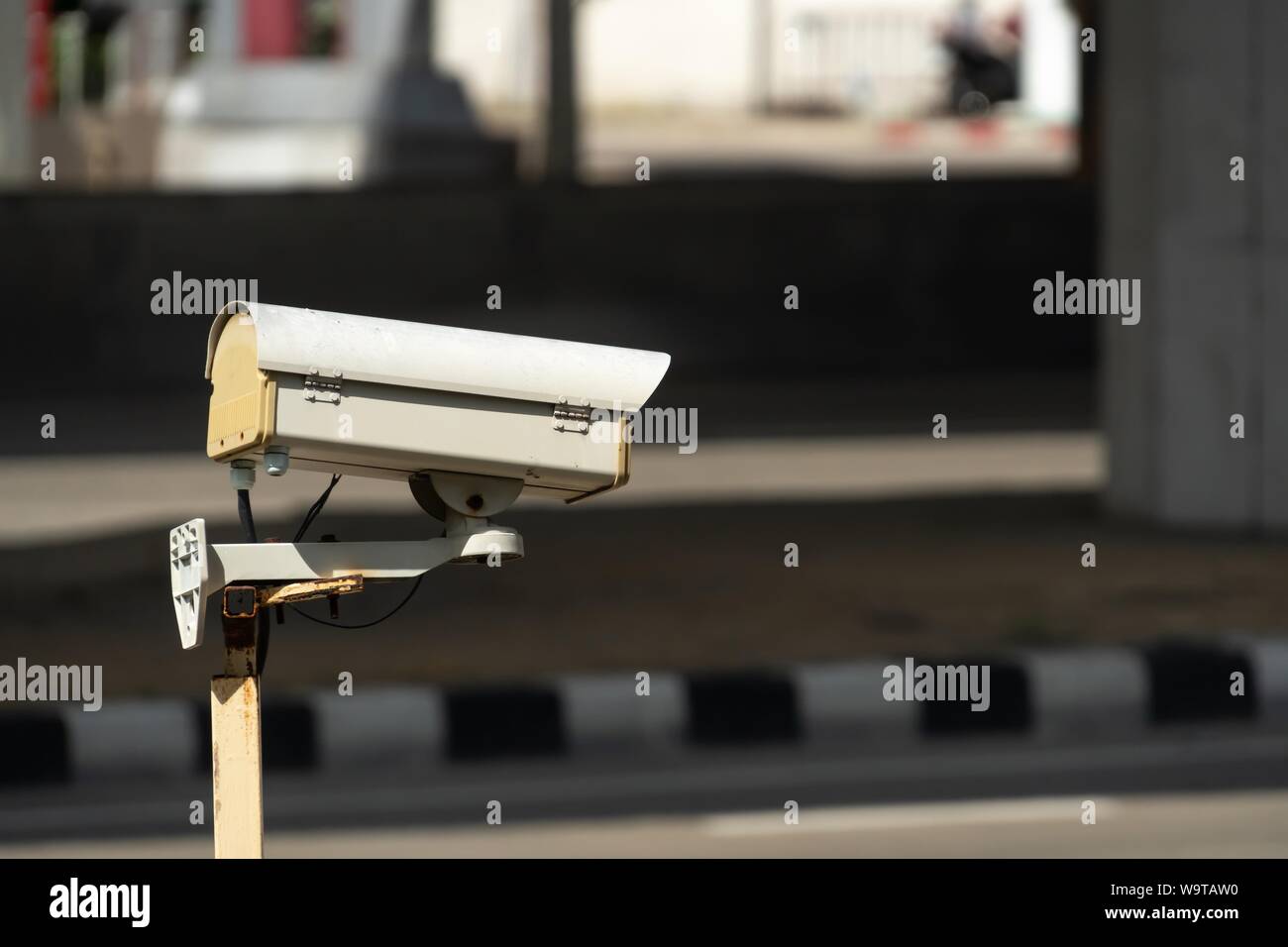 security monitoring CCTV camera mounted on old pole steel post Stock ...