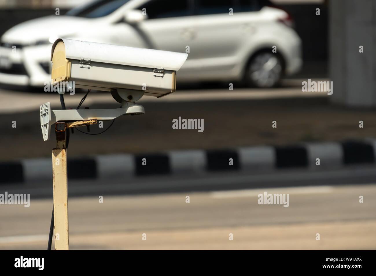 security monitoring CCTV camera mounted on old pole steel post Stock ...