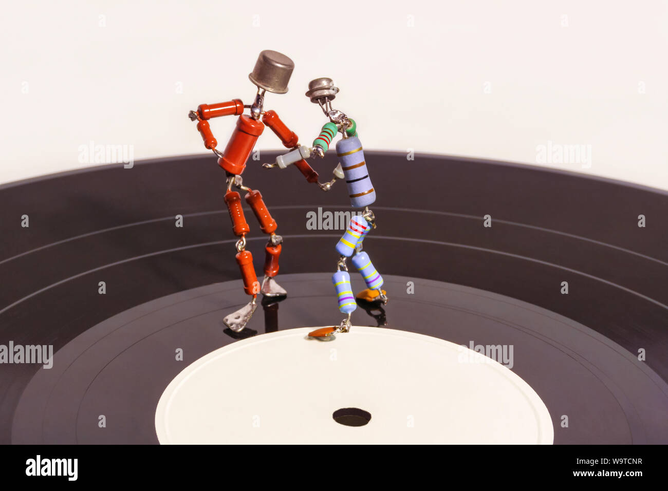 two funny small human figures, roughly welded together from resistors ...