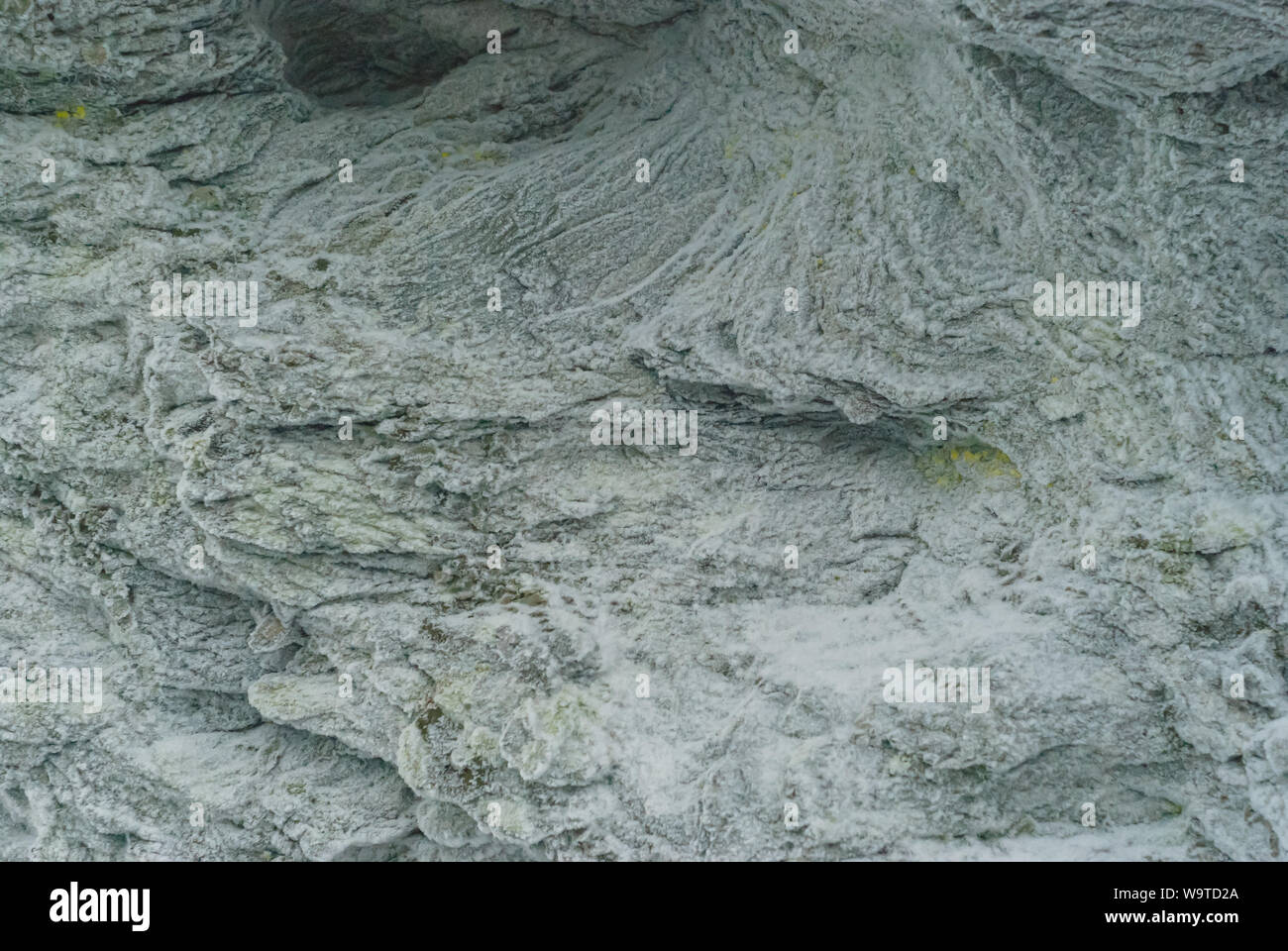 background, texture - bizarrely wrinkled surface of natural old rock ...