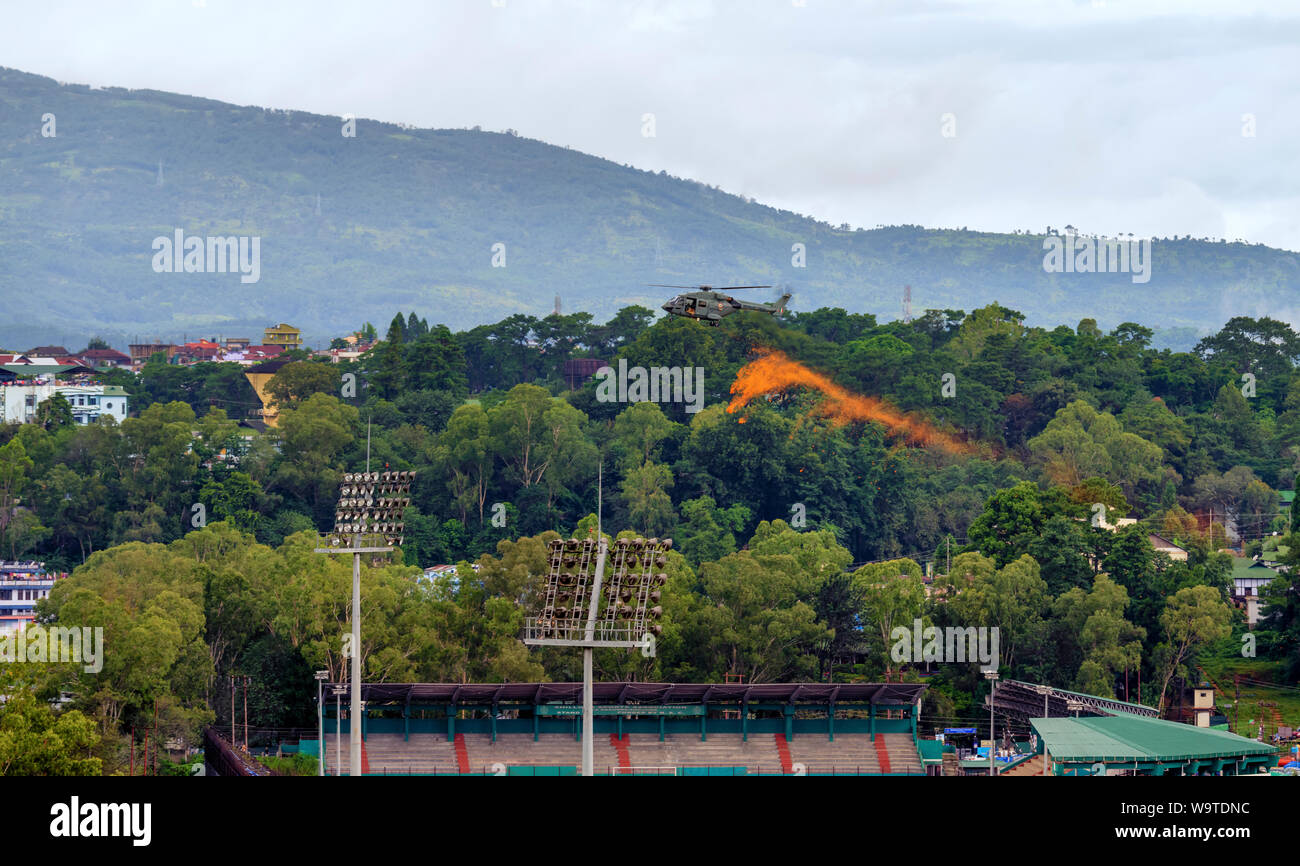 An Indian Air Force Dhruv helicopter drops flower petals on the people ...