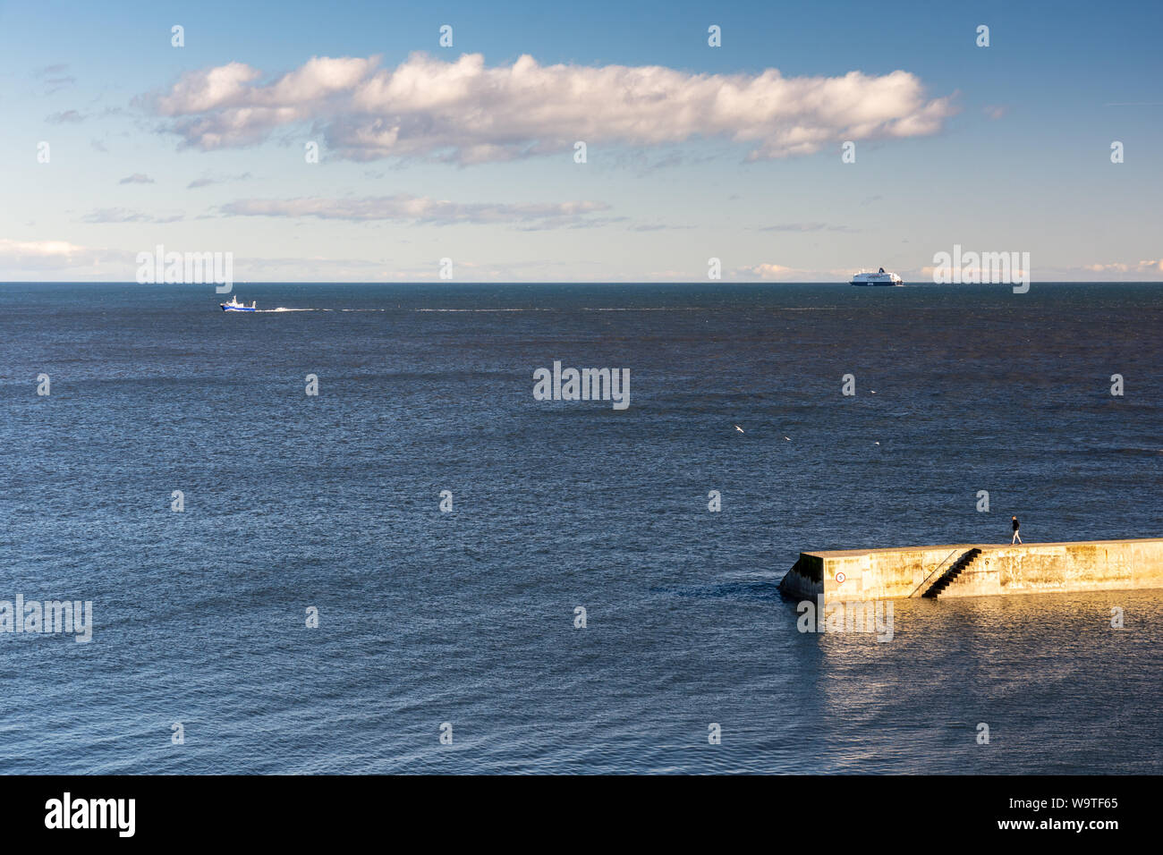 Tynemouth, England, UK - February 4, 2019: A person walks along the ...