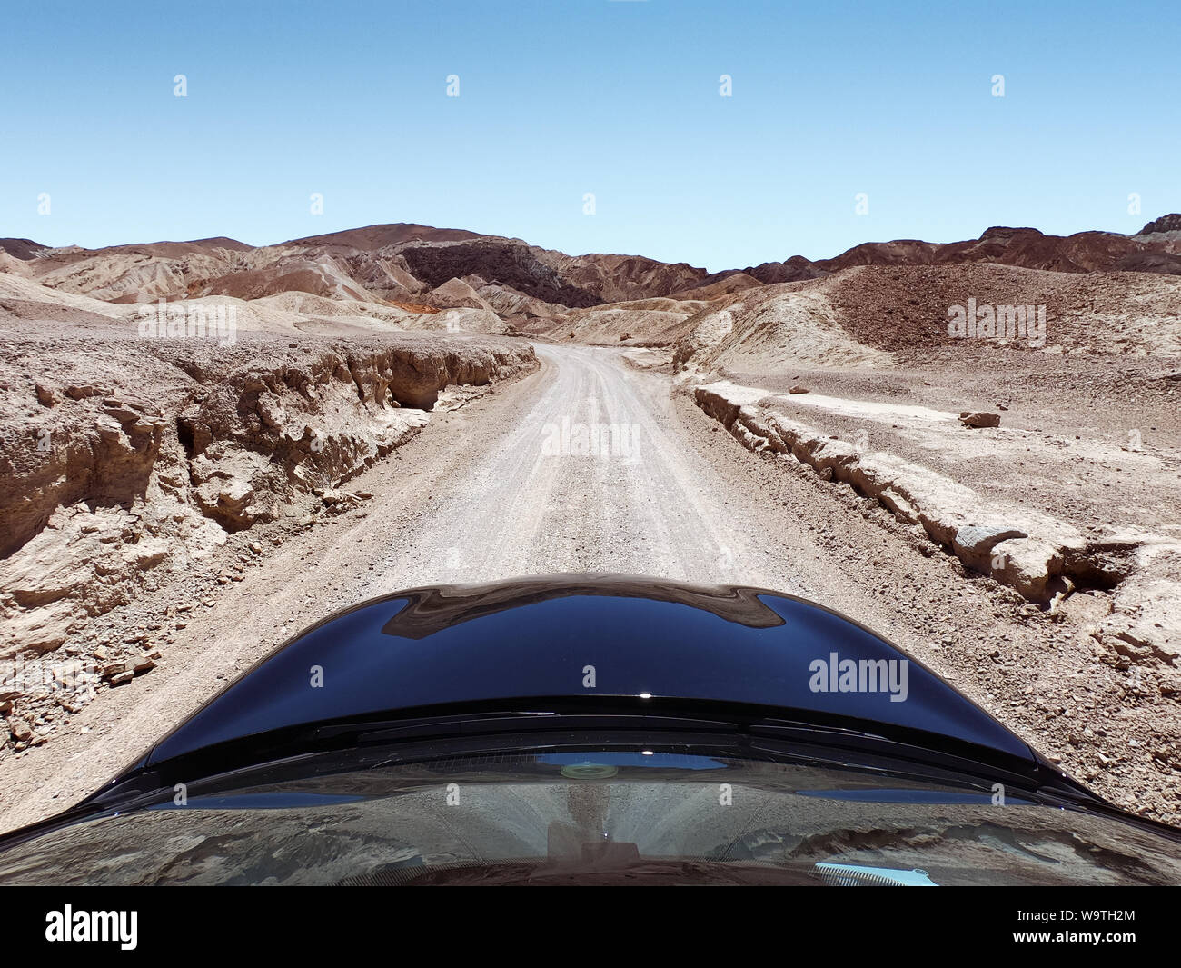 Car driving along a desert road, Death Valley National Park, Nevada ...