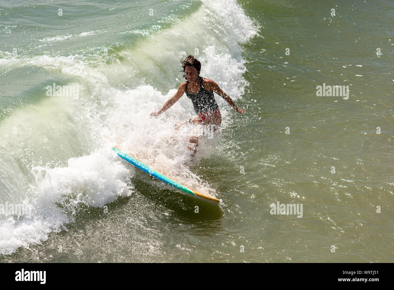 Female surfer falling off board hi-res stock photography and images - Alamy