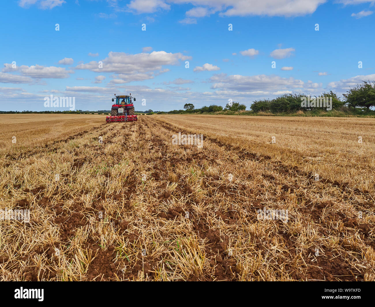 A Massey Ferguson 6490 tractor with a subsoiler and front mounted tank ...