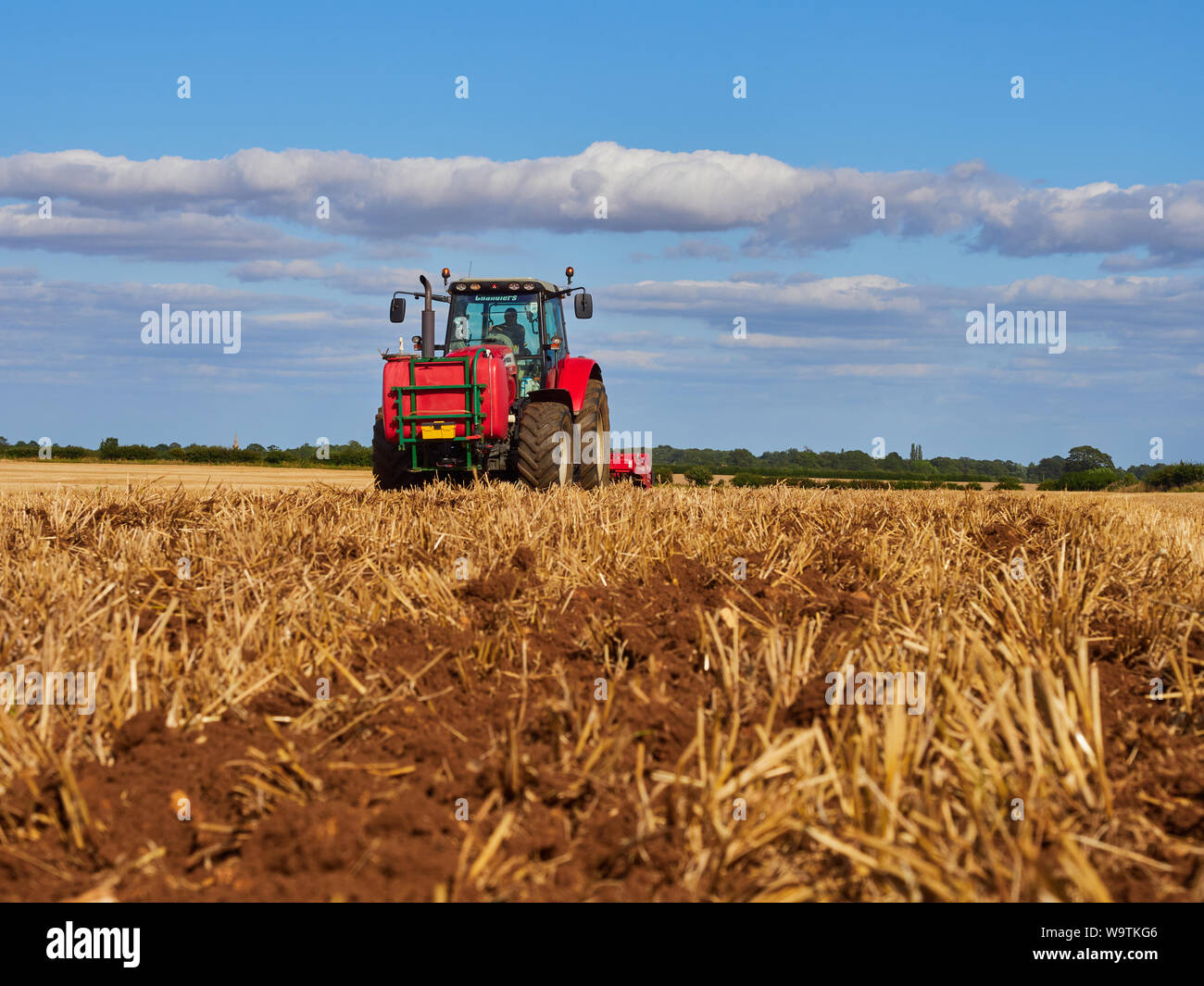 A Massey Ferguson 6490 tractor with a subsoiler and front mounted tank ...