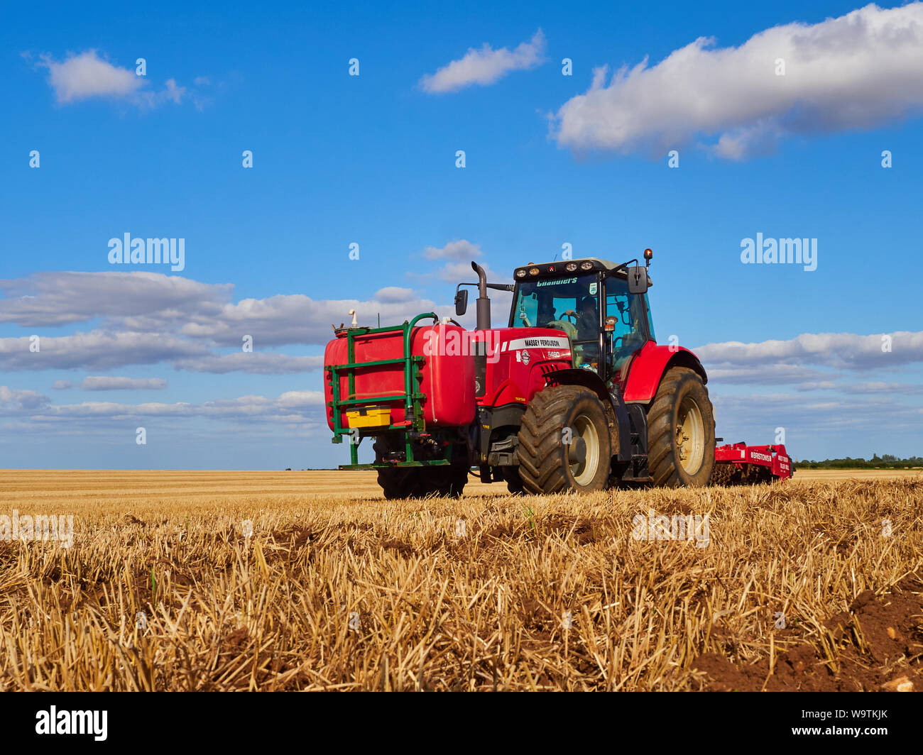 A Massey Ferguson 6490 tractor with a subsoiler and front mounted tank ...