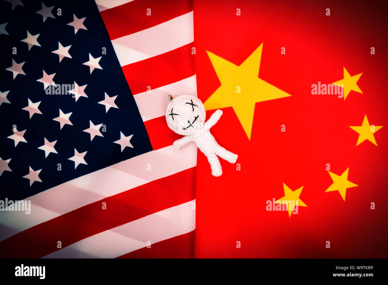 Voodoo doll on flags of the USA and China Stock Photo - Alamy