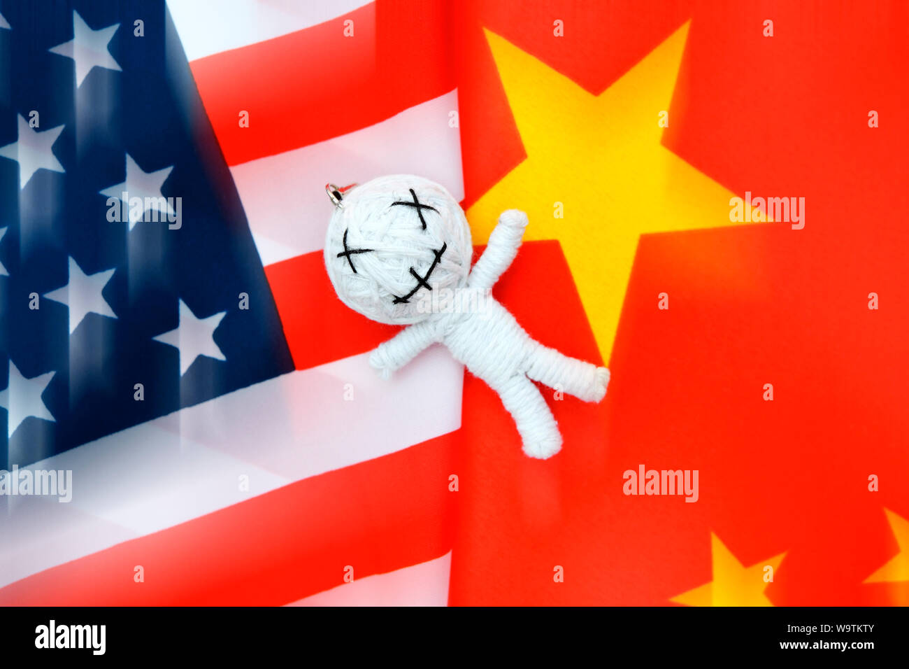Voodoo doll on flags of the USA and China Stock Photo - Alamy