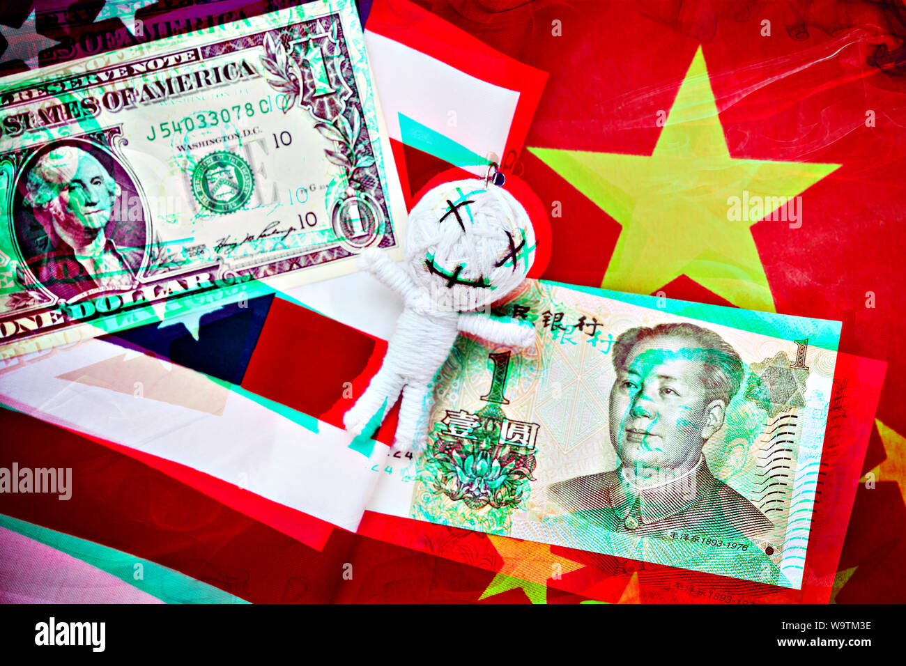 Voodoo doll and yuan and dollar banknotes on flags of the USA and China ...