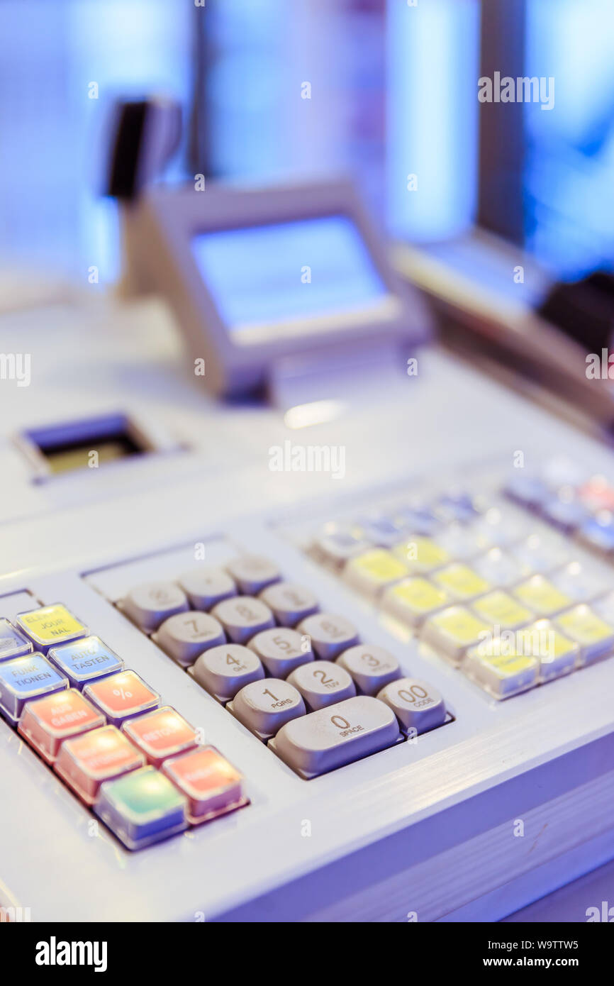 Cash register in a shop: Customer is paying purchase Stock Photo - Alamy