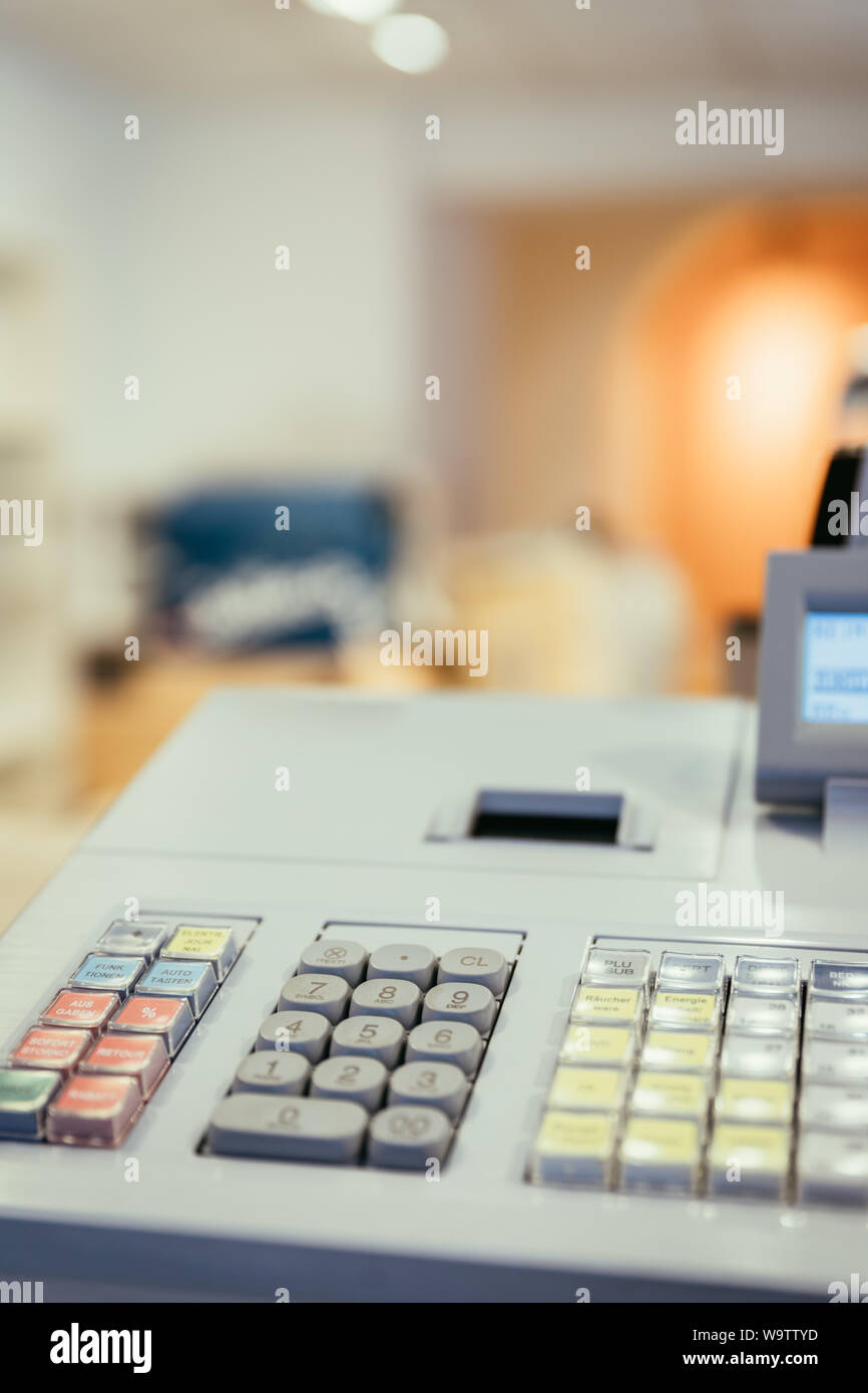 Cash register in a shop: Customer is paying purchase Stock Photo - Alamy
