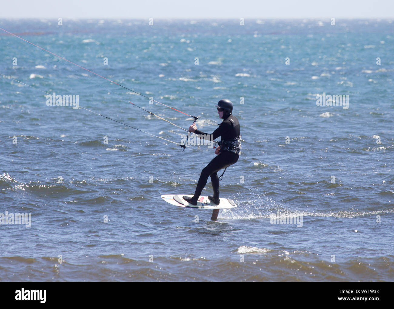 Hydrofoil kite surfer showing feet on top of board hi-res stock ...