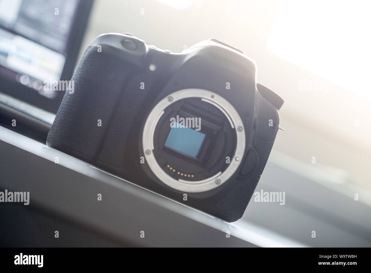 Professional reflex camera on a table, camera sensor Stock Photo - Alamy