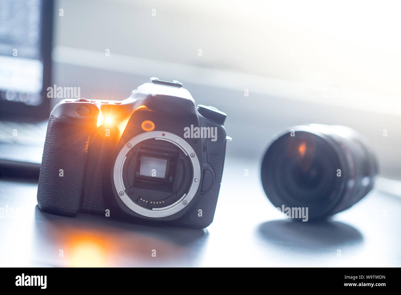 Professional reflex camera on a table, camera sensor. Lenses in the ...