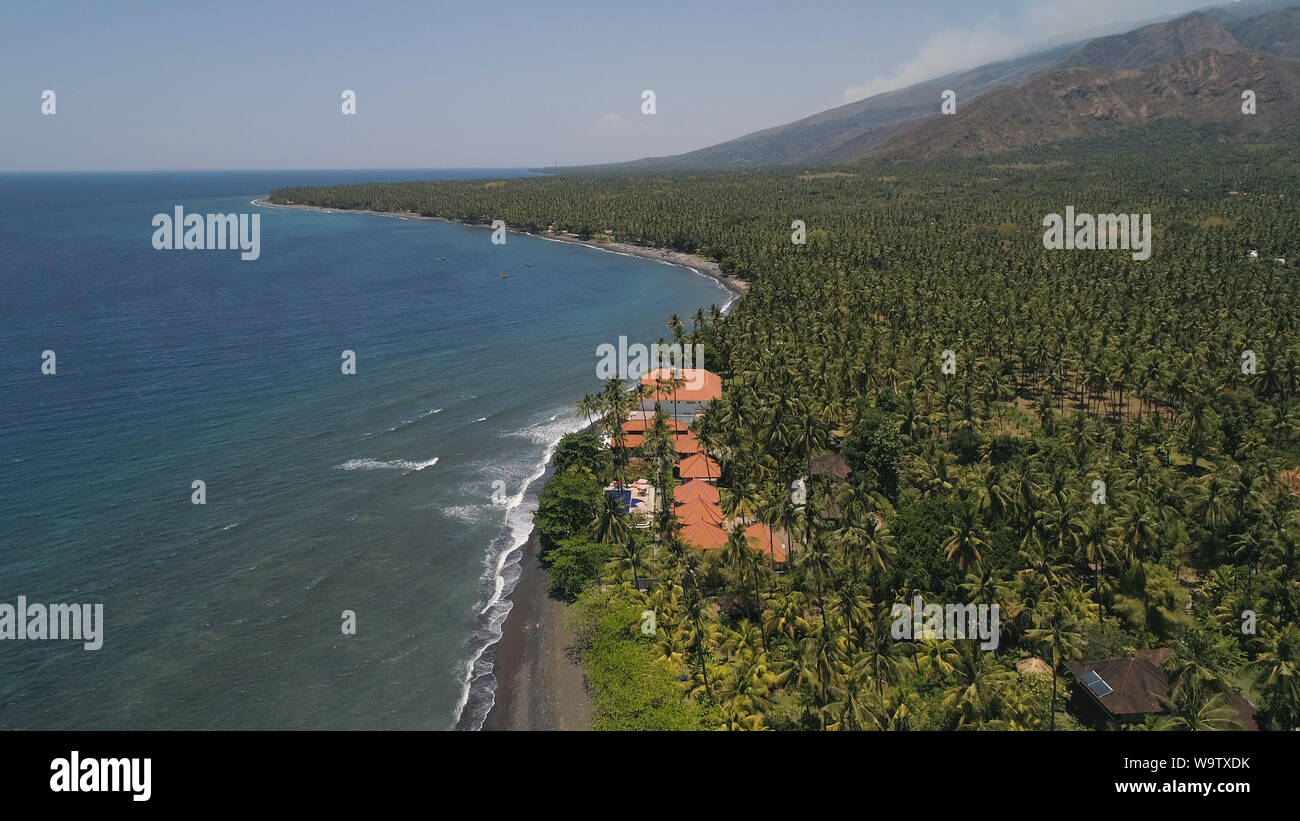 aerial seascape luxury hotel on beach background mountainss in tropical ...