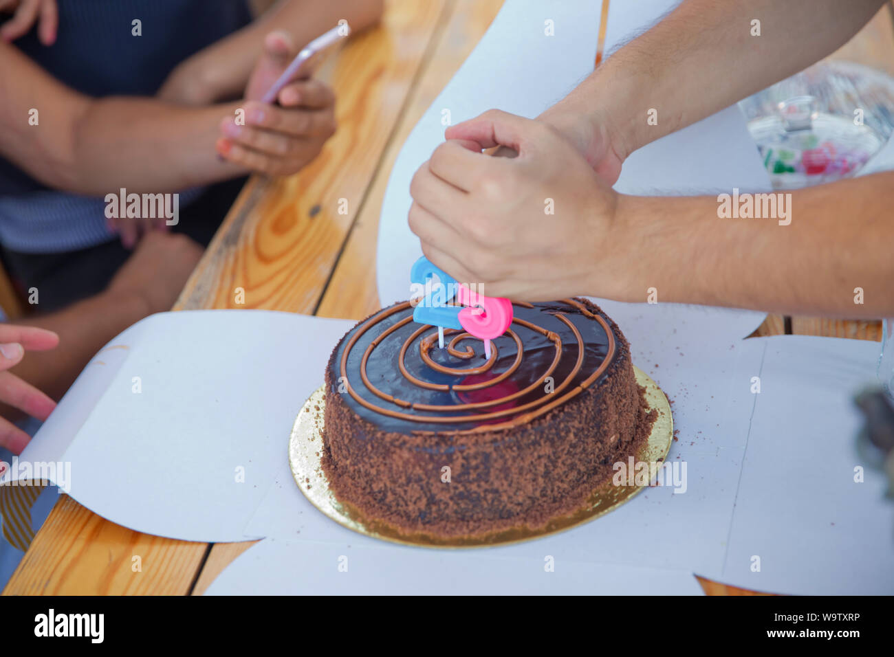 Round chocolate cake. Tasty chocolate cake on chair . A tall rich ...
