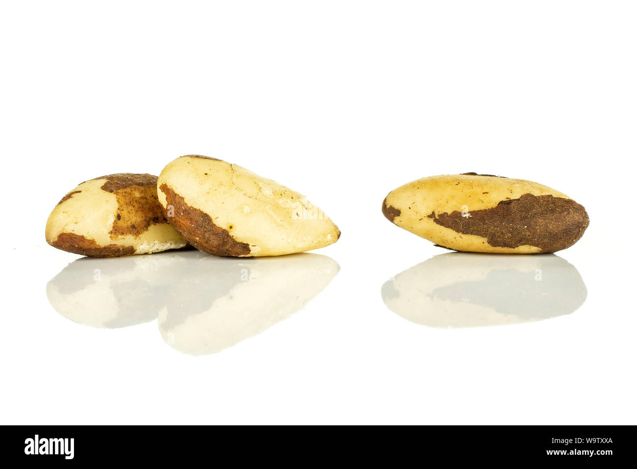 Group of three whole unshelled brazil nut isolated on white background ...