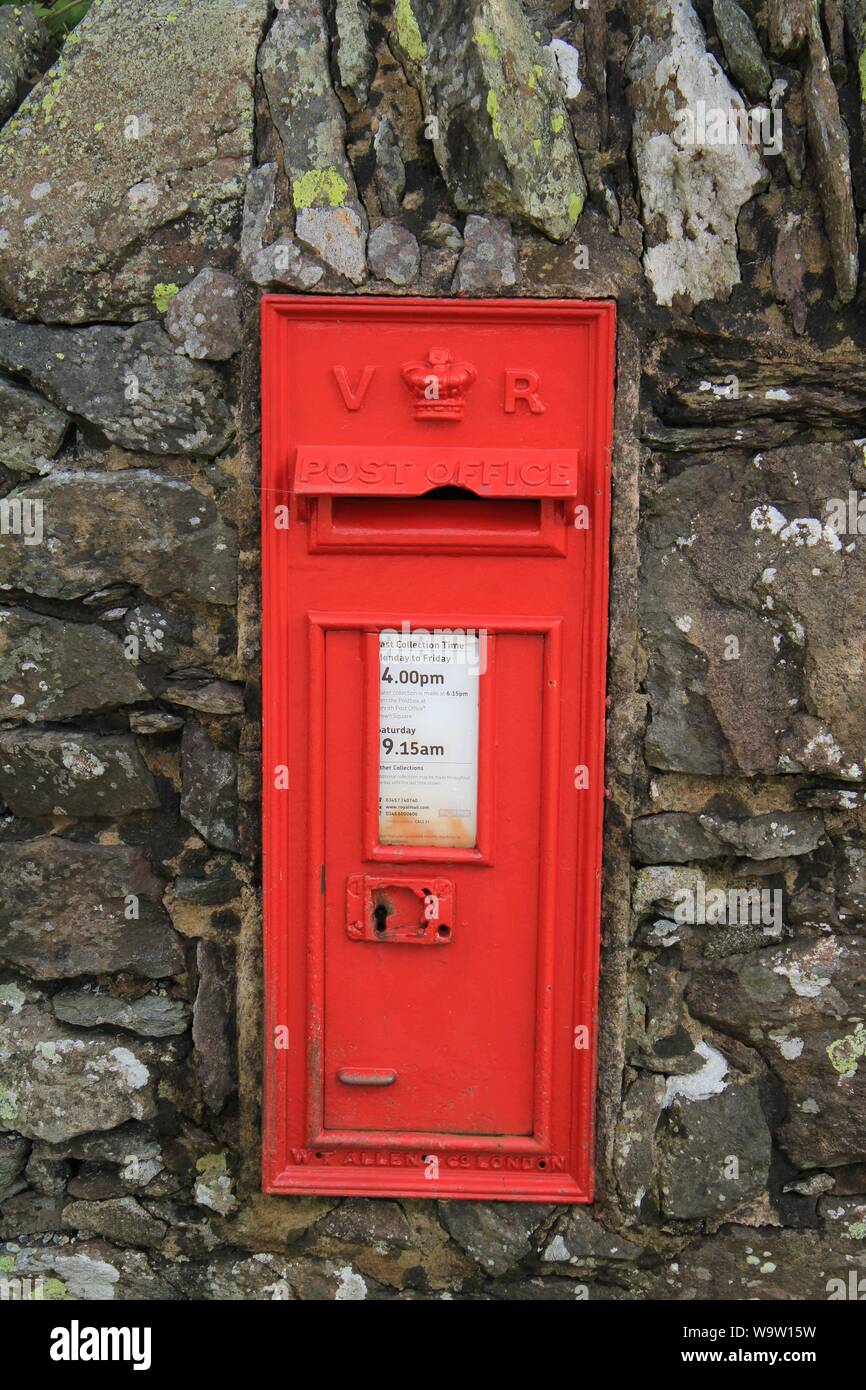 Red Royal Mail postbox in dry stone wall. UK Watermillock, Ullswater ...