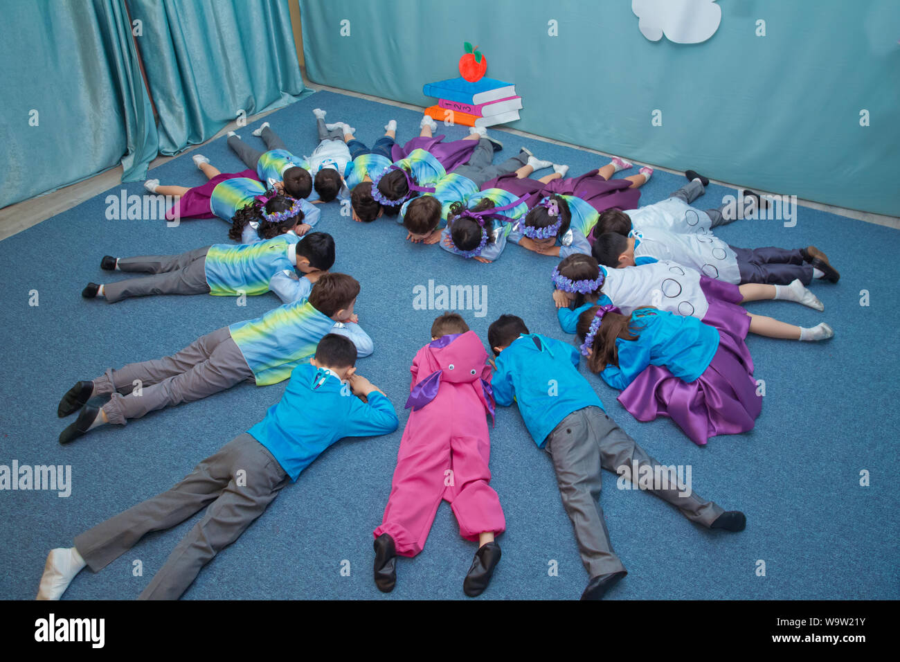 The children stretched round . The children stretched out in a circle ...