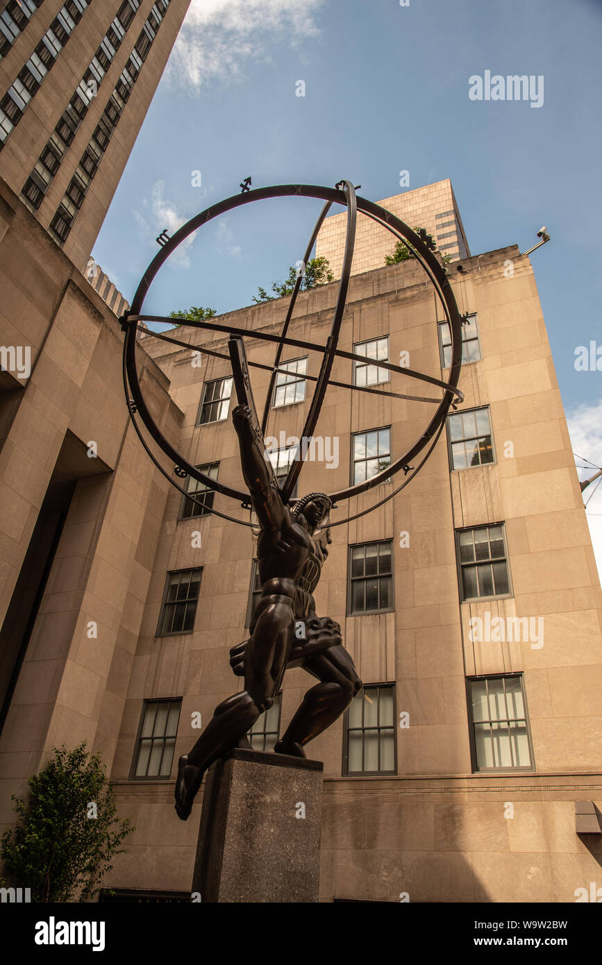 The statue of Atlas is located on the fifth avenue of NYC by the ...