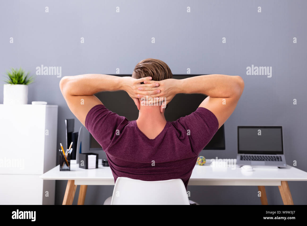 Boss sitting behind desk hi-res stock photography and images - Alamy