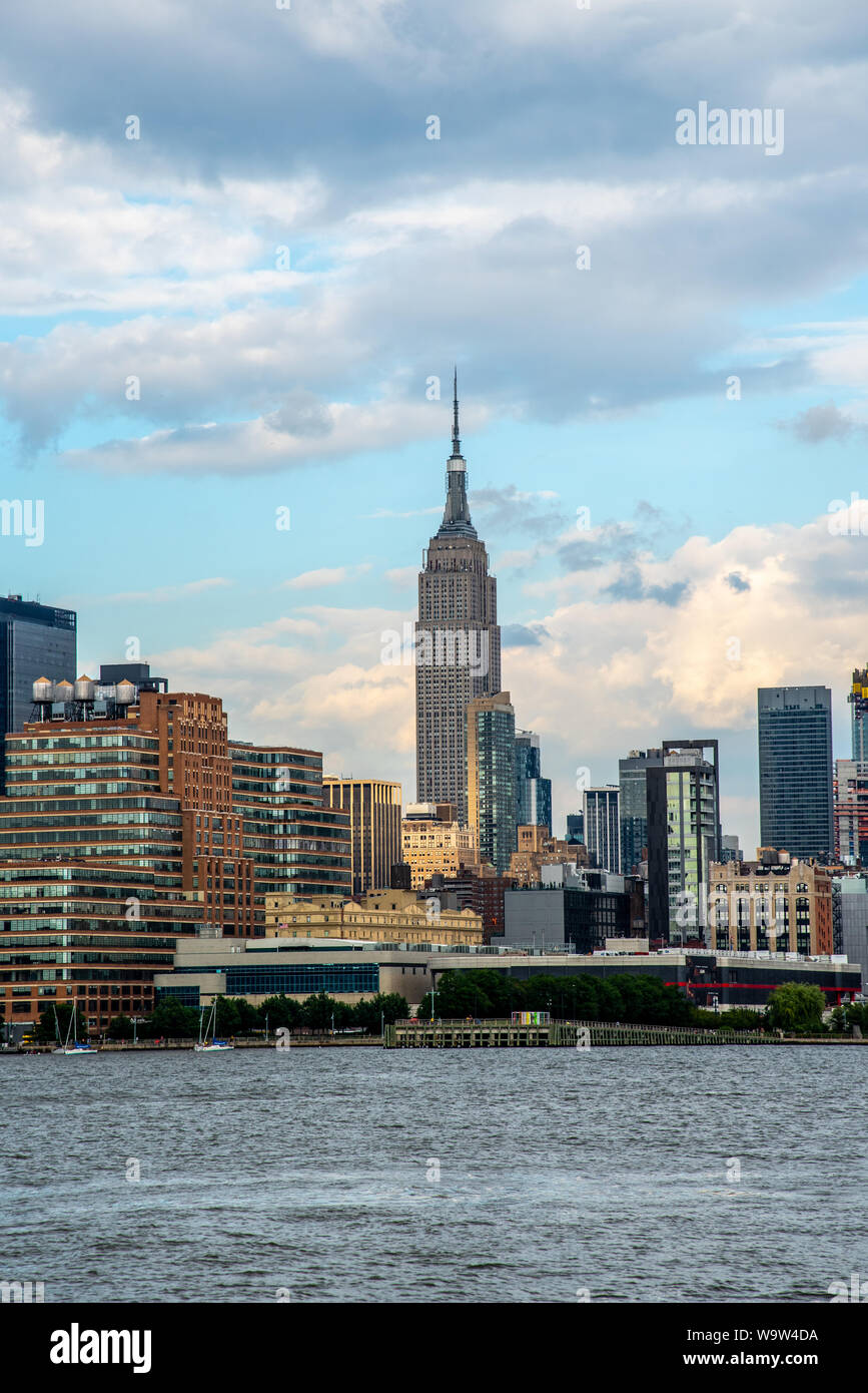 Empire state protruding from midtown Manhattan Stock Photo - Alamy