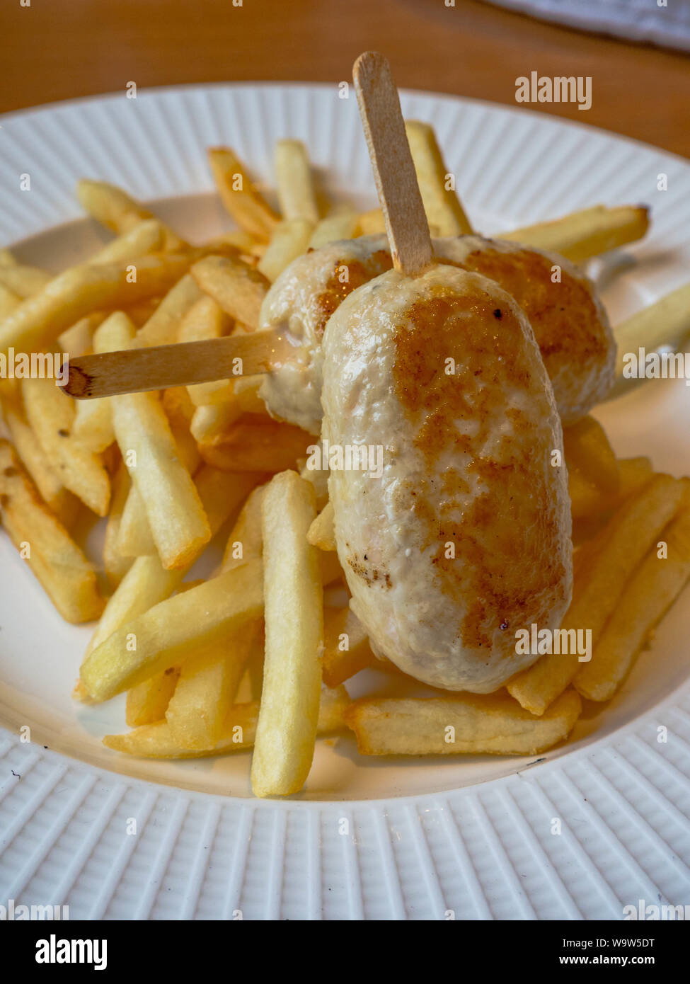 child menu - french fries and chicken popsicle cutlets on white plate ...