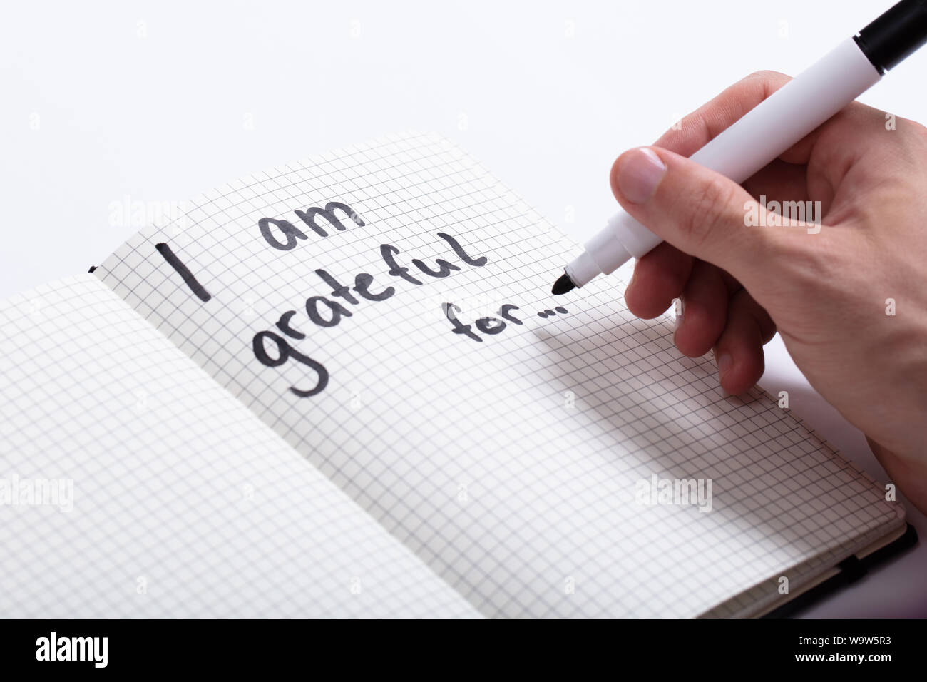 Close-up Of A Person Writing I Am Grateful For Text In Notebook With ...