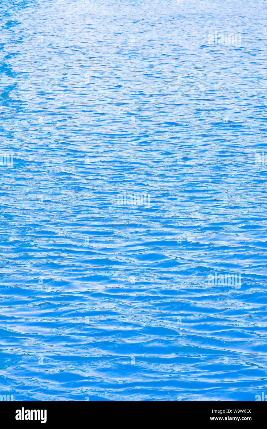 Perspective view of clean blue water surface Stock Photo - Alamy