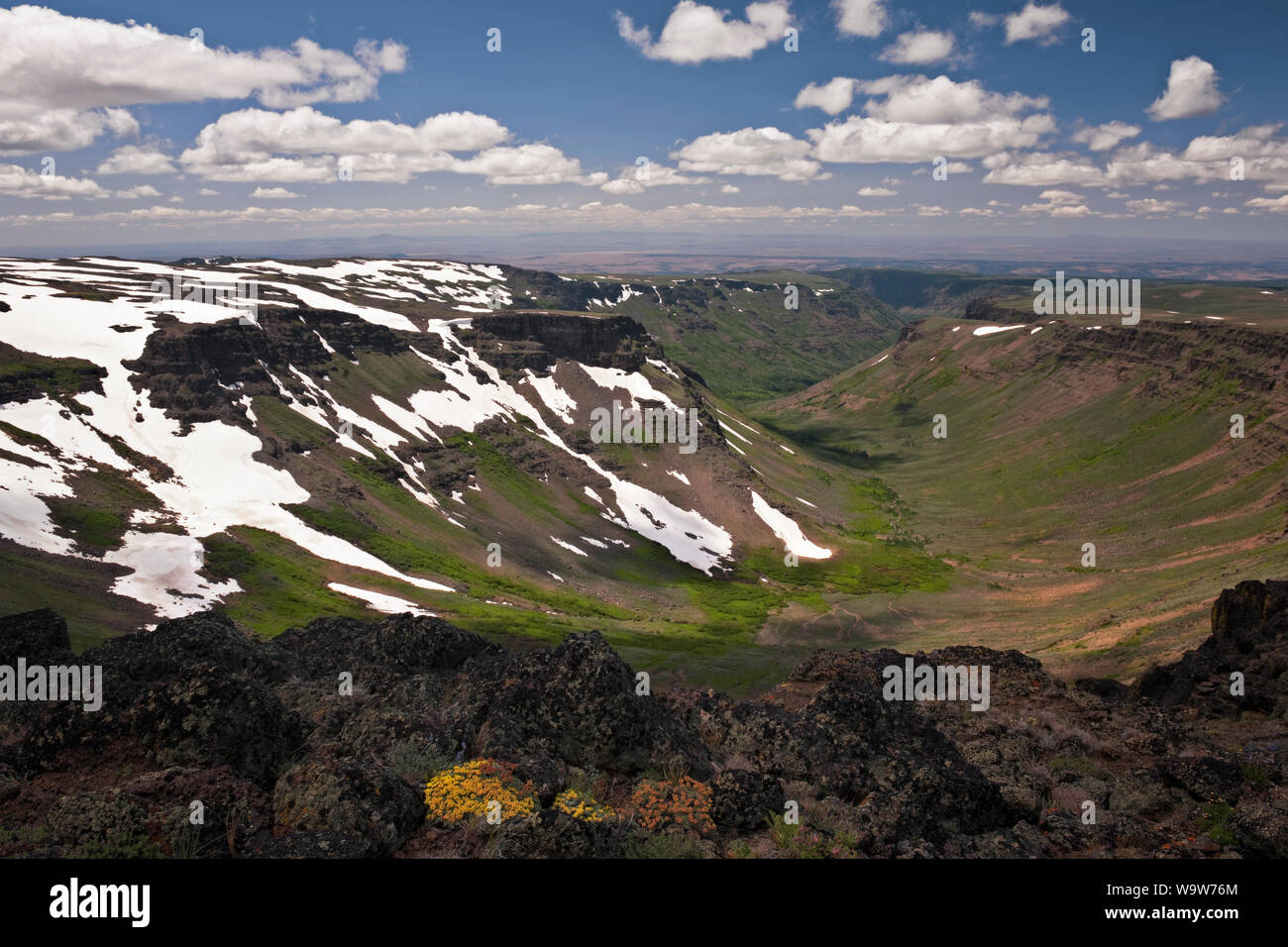 Snow shelf extends into July overlooking this spectacular view of Kiger ...