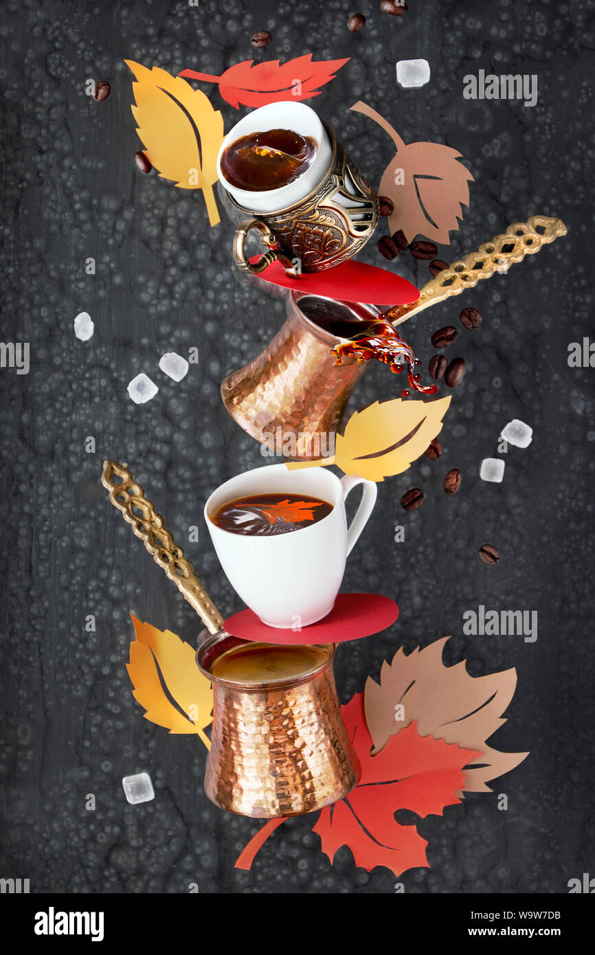 Balancing pyramid of jezves, turkish coffee pots and cups on dark ...