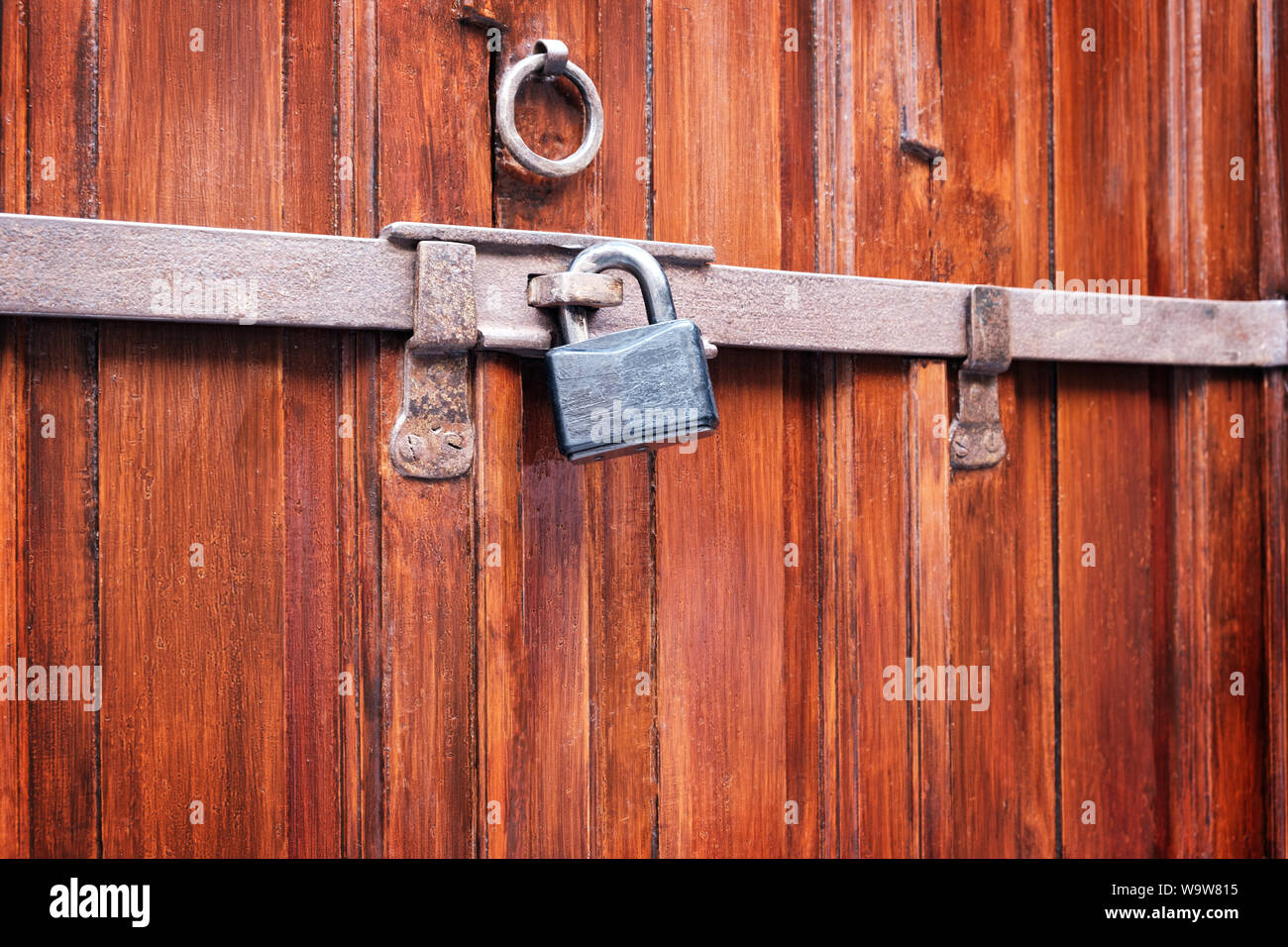 Closed wood lock red wooden door security Stock Photo - Alamy