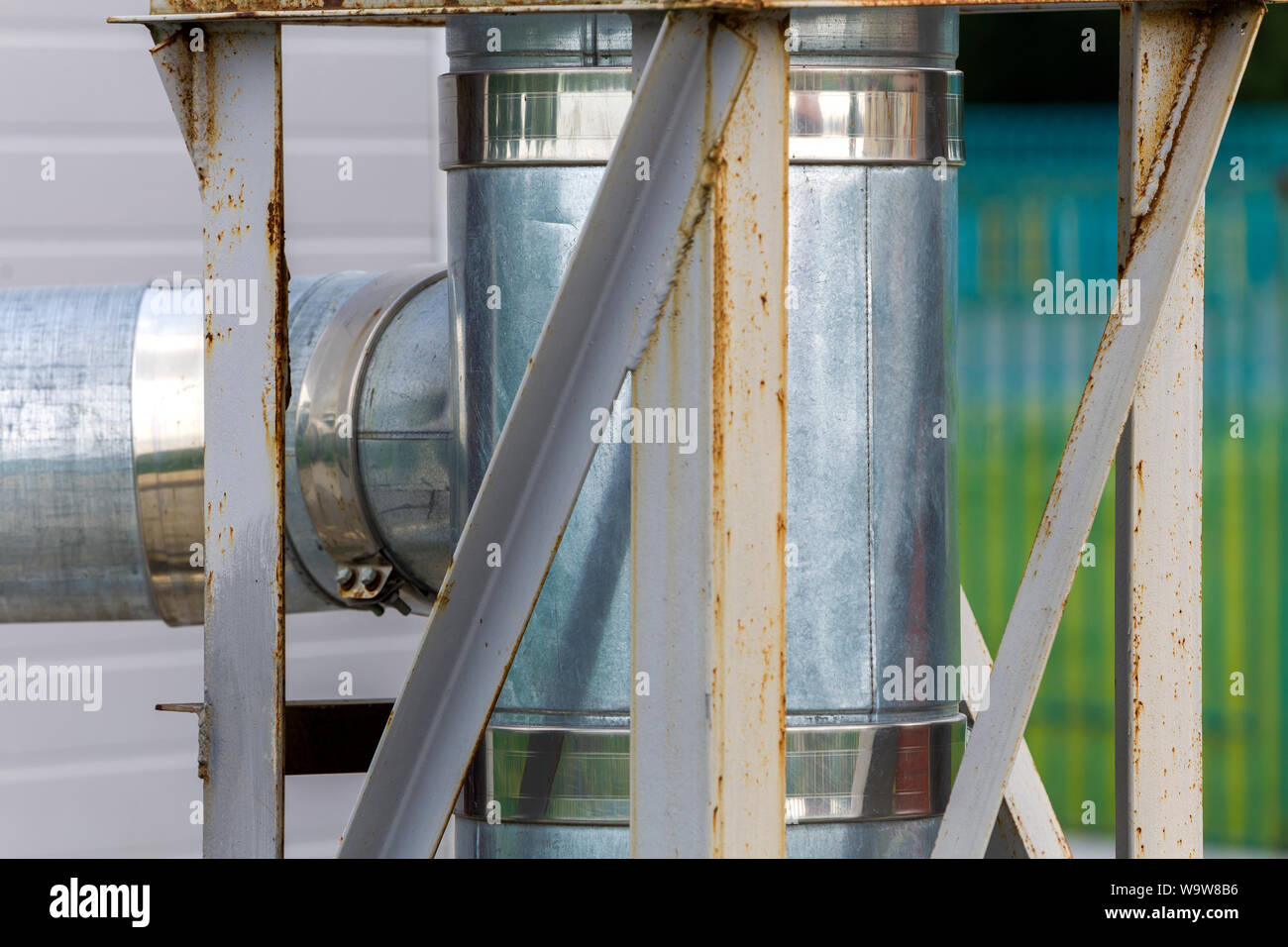 Metallic exhaust smoke pipes installed on house exterior wall Stock ...