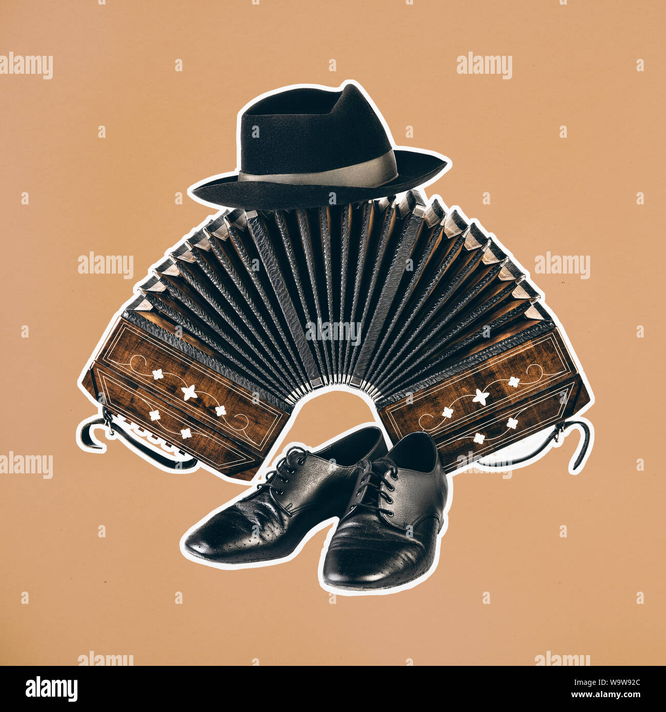 Bandoneon, tango instrument withpair of male dancing shoes and a hat on ...