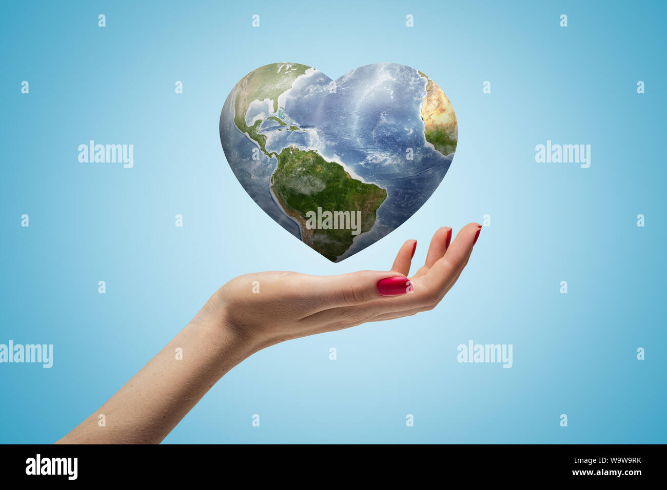 Woman holding up world globe hi-res stock photography and images - Alamy