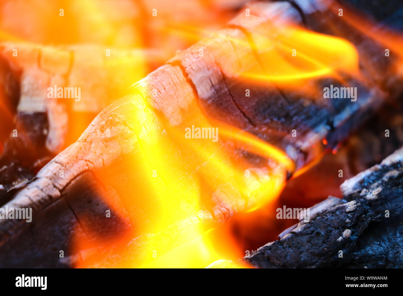 Beautiful color of burning red coals and black charred wood. Orange hot ...