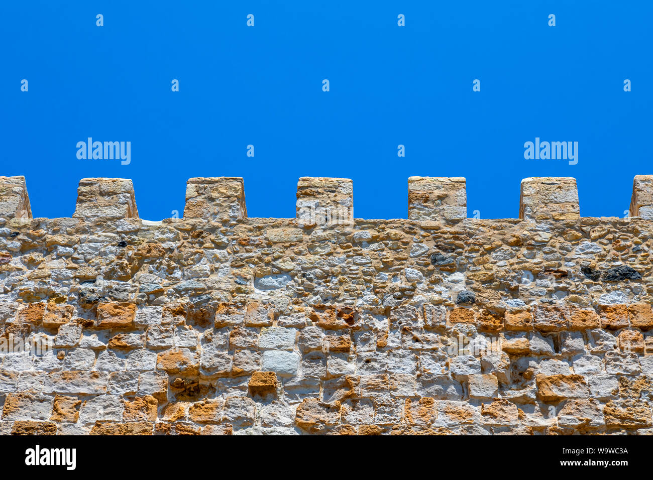 Old fortification wall detail under blue sky Stock Photo - Alamy