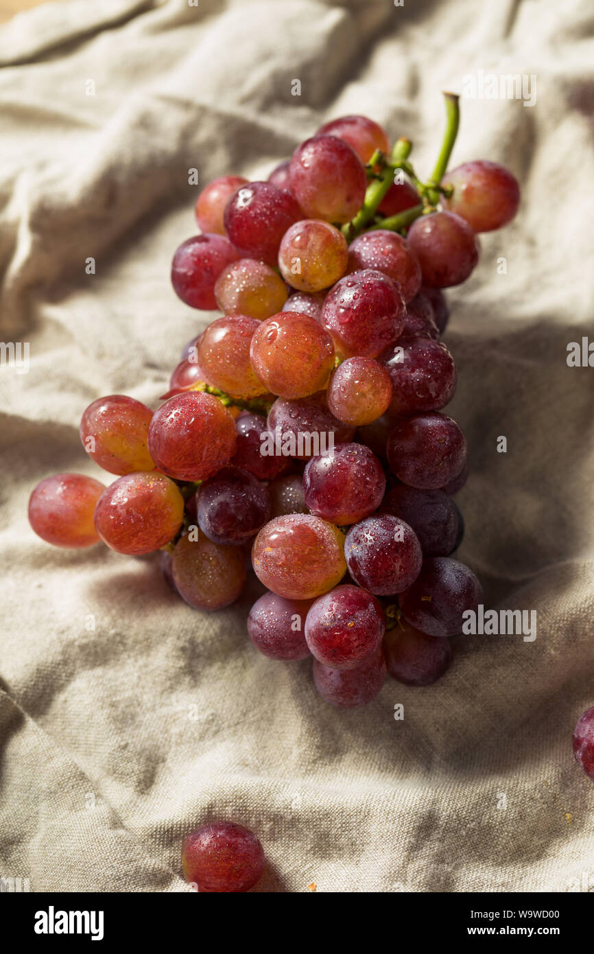 Raw Red Organic Grapes in a Cluster Stock Photo - Alamy