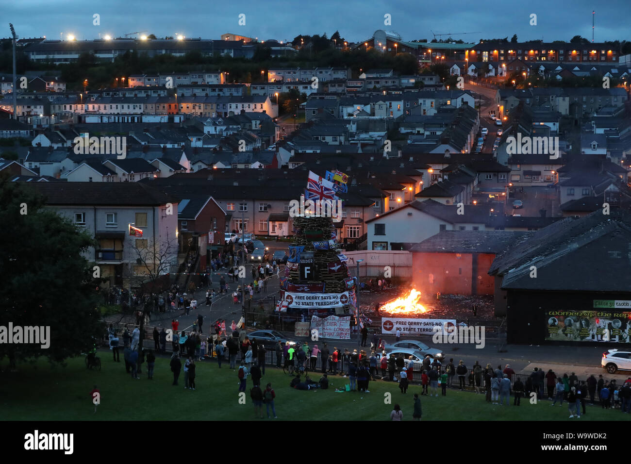 A smaller bonfire is burned before larger hi-res stock photography and ...