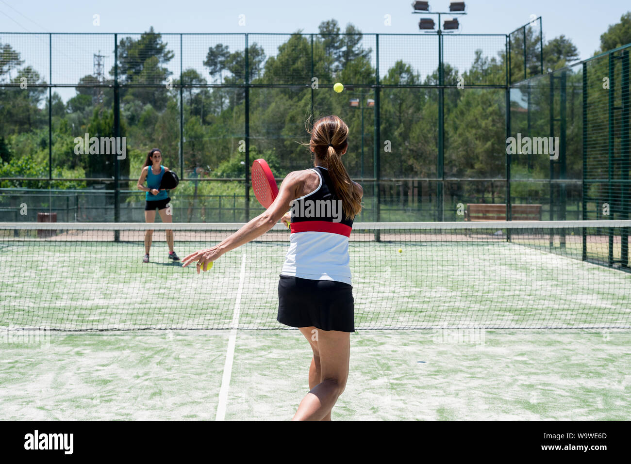 Two women playing padel outdoor Stock Photo - Alamy
