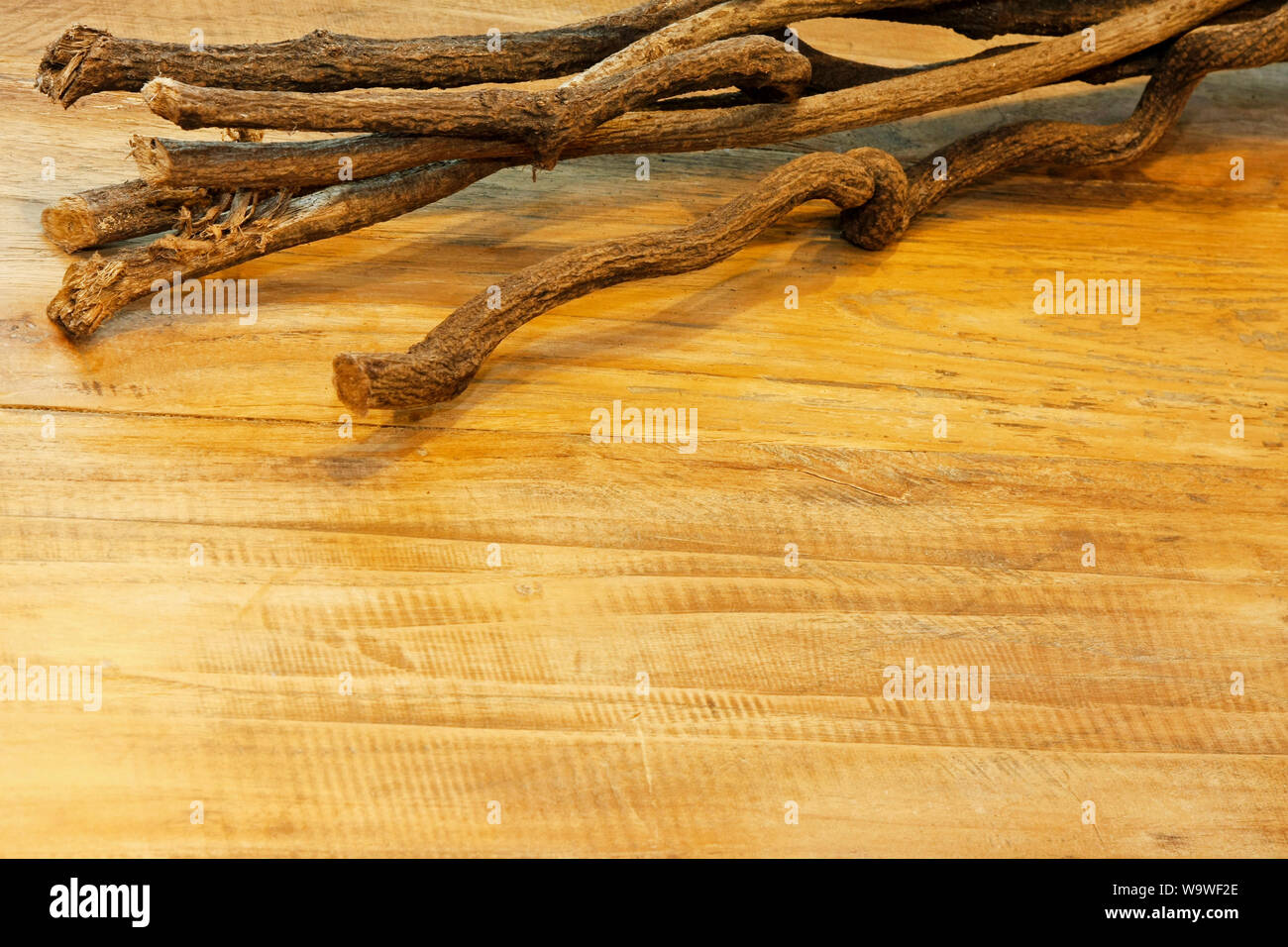 Old tree branch decor at wooden floor Stock Photo - Alamy