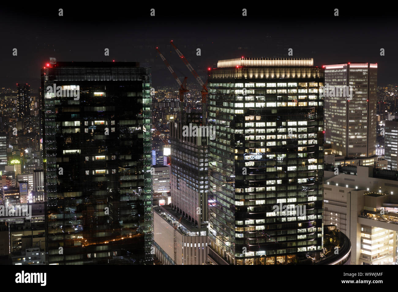 Modern high rise buildings at night in Osaka, Japan Stock Photo - Alamy