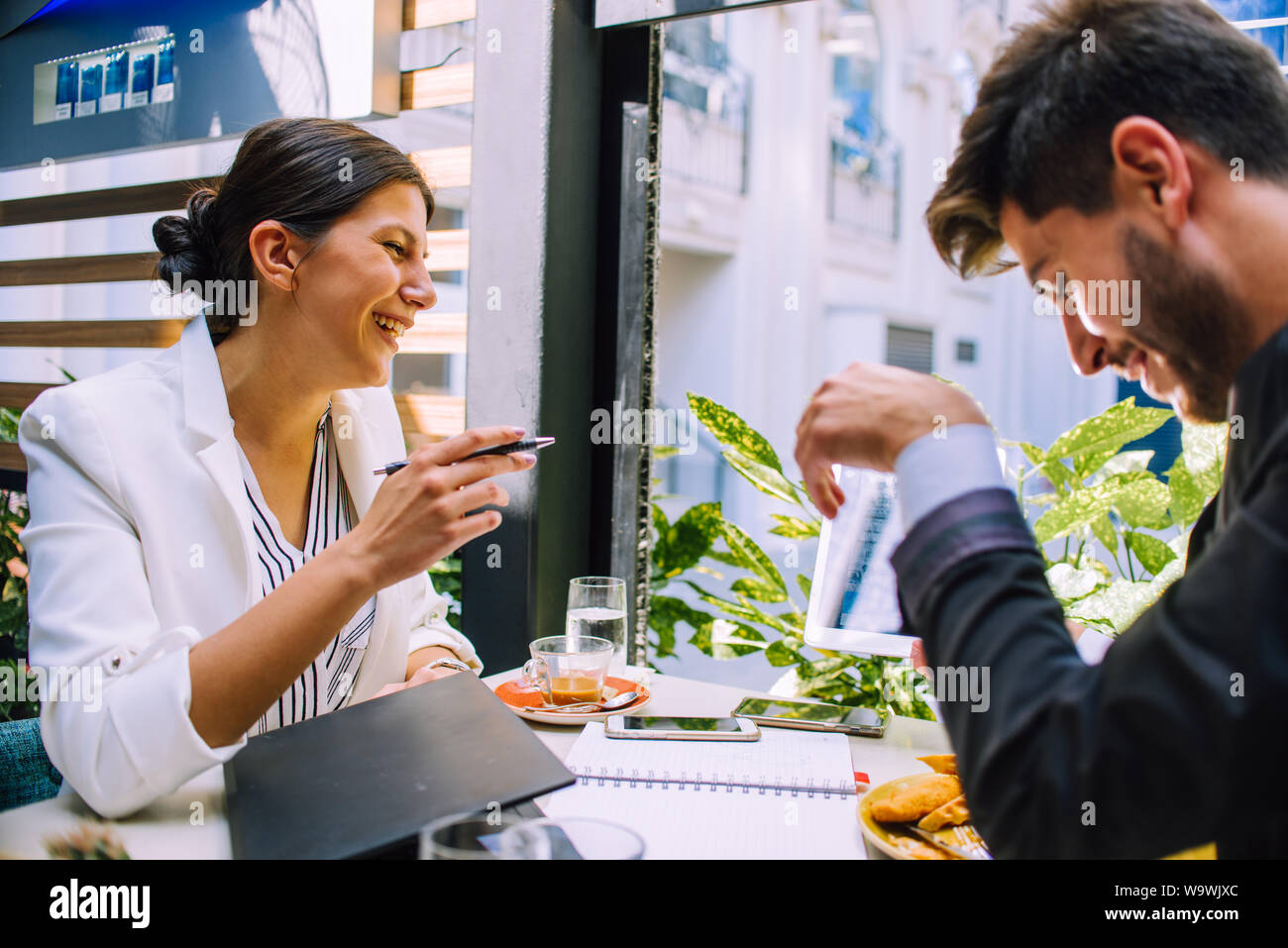 Colleagues taking coffee break outdoors hi-res stock photography and ...