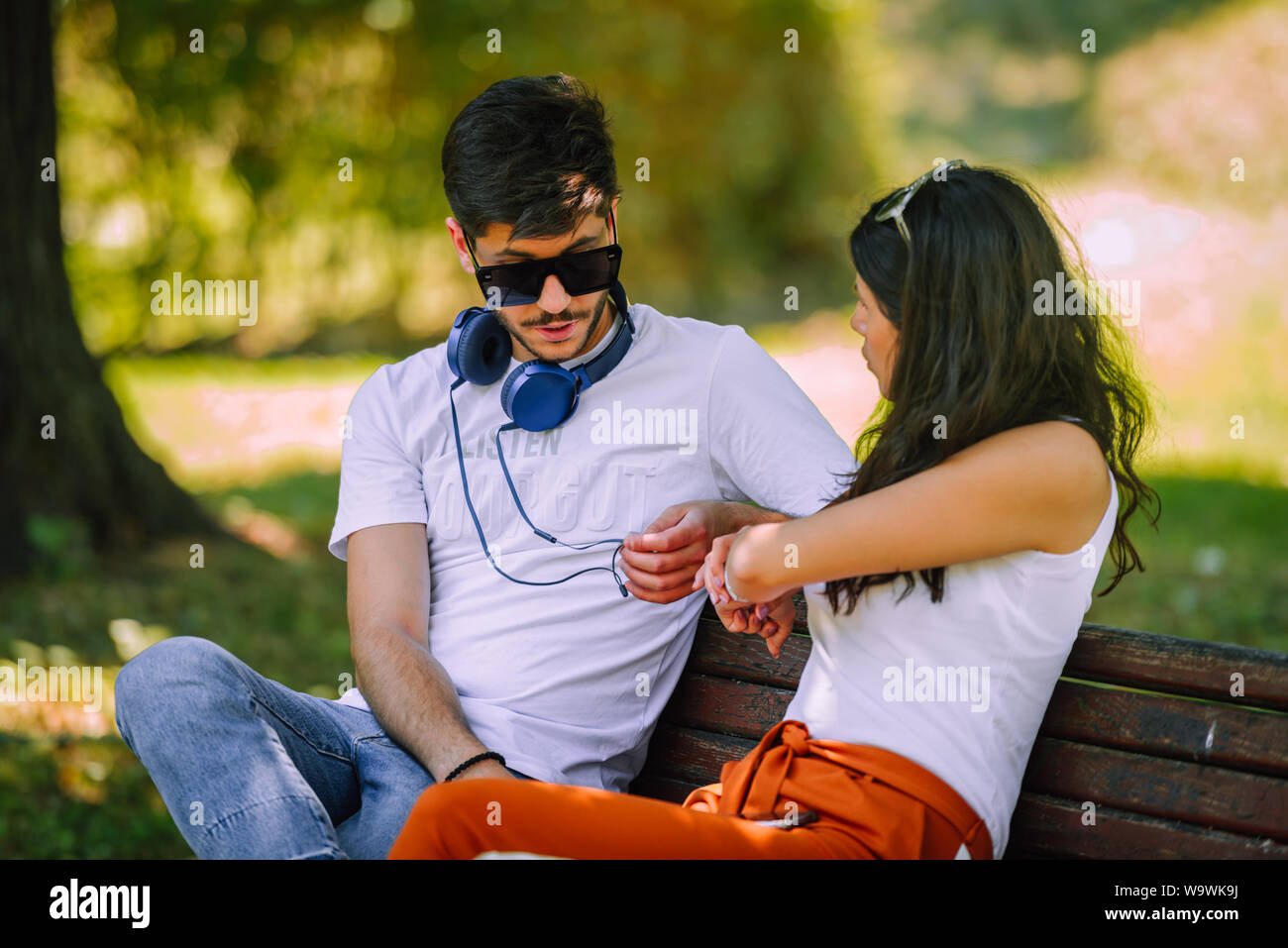 Best friends enjoying time together outdoors on bench. Concept of two ...